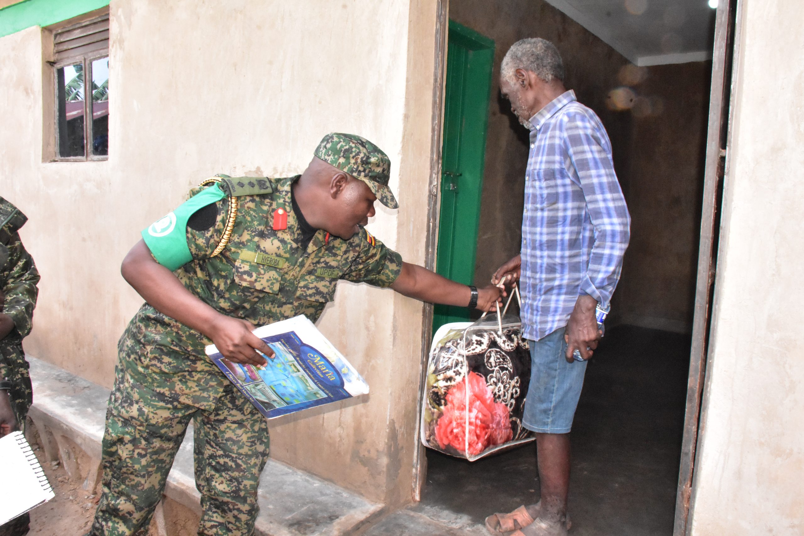 PHOTOS: UPDF contingent in DRC builds house for 80-year, Mzee Sefuko ...